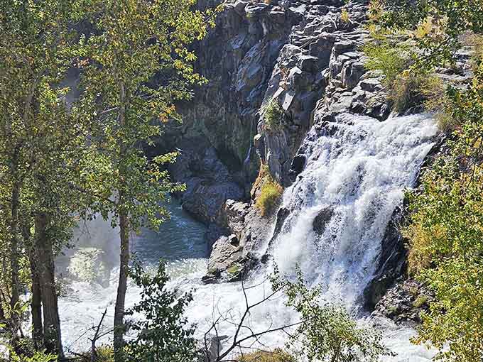 From this angle, the falls reveal their full power, crashing into pools that shimmer with surprising color.