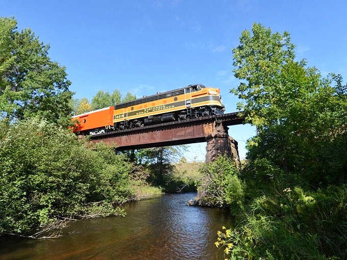 The train crossing that bridge looks like a postcard come to life, minus the cheesy caption someone's aunt would write.