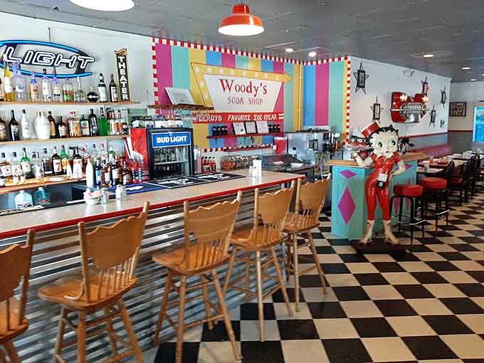 The bar area with its colorful signage and wooden stools offers front-row seats to small-town hospitality at its finest.