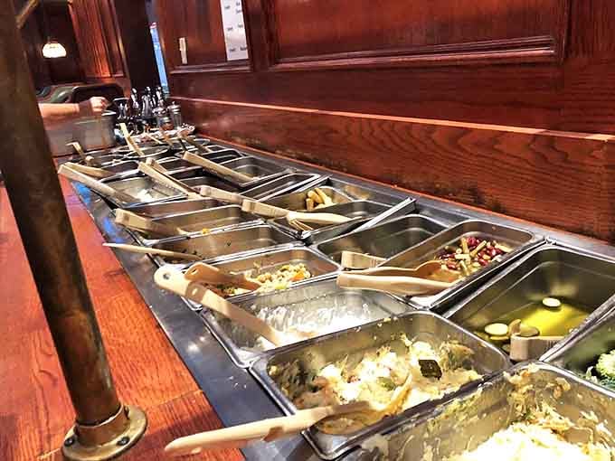 The salad bar offers fresh toppings and fixings, proving that even train diners understand the importance of vegetable options.