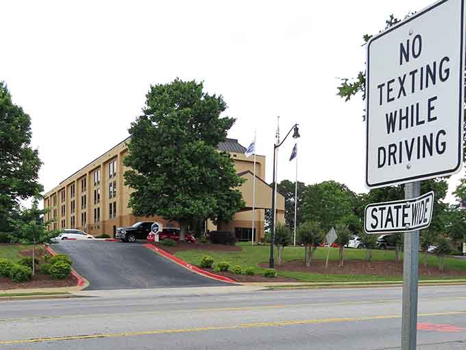 Beautiful Clemson days mean putting your phone away to enjoy the scenic drive past lush green trees and local hotels.
