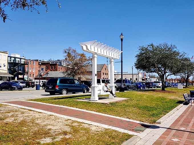 That white pergola frames the town green perfectly, like a picture frame around small-town American life.
