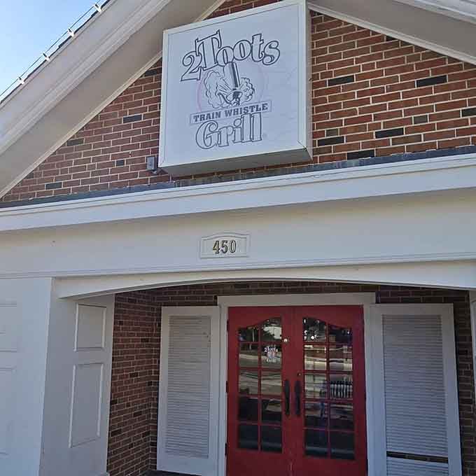 The 2Toots signage promises exactly what it delivers: trains, whistles, and seriously good food in Glen Ellyn.