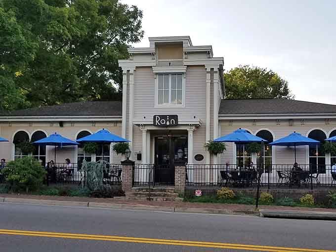 Blue umbrellas beckon diners to experience upscale cuisine in a setting that honors both past and present beautifully.