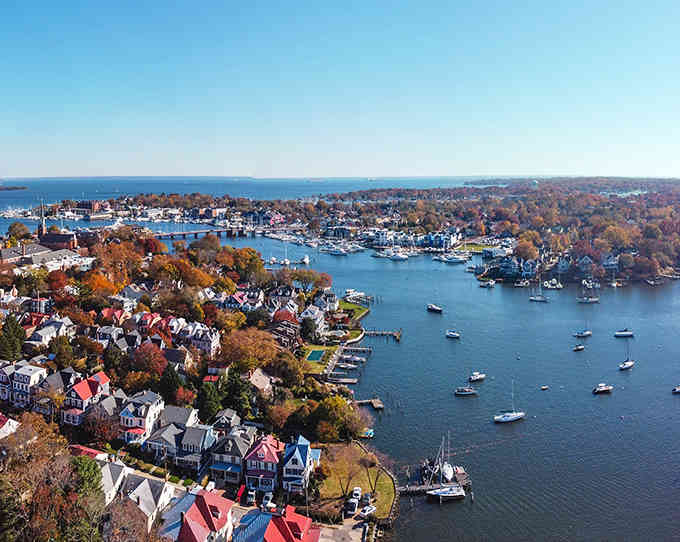 Aerial views reveal a city where red roofs, blue water, and fall colors create Maryland's prettiest puzzle.