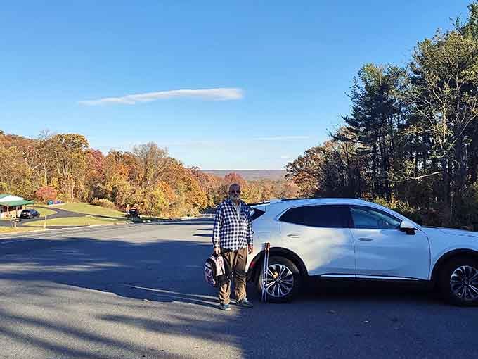The trailhead parking lot marks where your adventure begins, and your car patiently waits for stories.