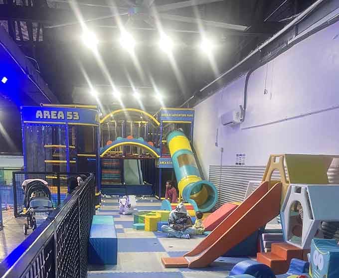 Multi-level play structures create a maze of fun that exhausts children and delights supervising adults equally.