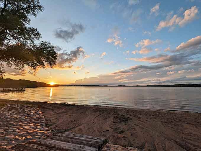Sunset over the beach transforms ordinary evening into something worthy of a thousand phone photos nobody asked for.