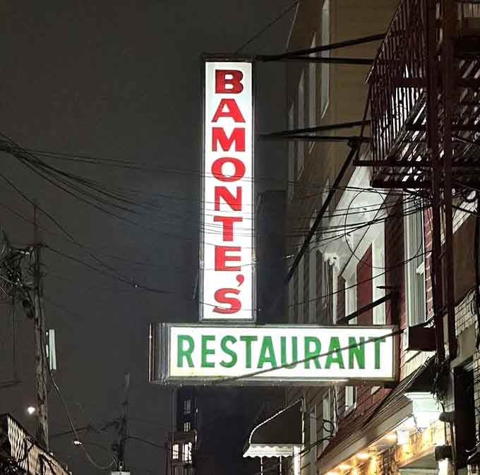 That iconic vertical sign has been guiding hungry souls to exceptional Italian food for longer than most restaurants survive.