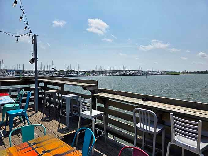 Outdoor waterfront seating where the boats passing by provide better entertainment than any television screen could offer.