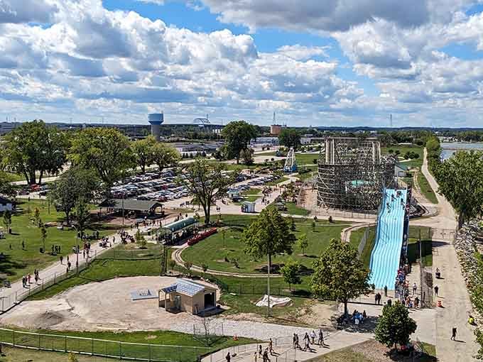 From above, the entire park spreads out like a carefully arranged collection of joy, bordered by mature trees and sparkling water.