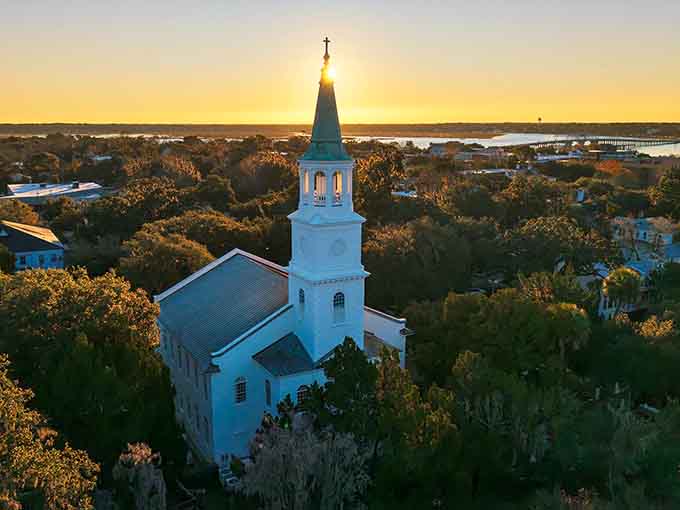 Sunrise gilds the church steeple in liquid gold, reminding early risers why getting up before dawn is sometimes worth it.