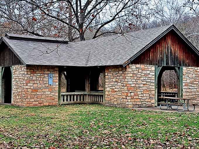 Stone and timber craftsmanship that proves the 1930s knew how to build a picnic shelter with actual character and charm.