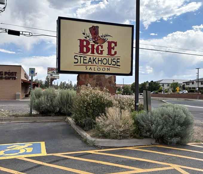 The roadside sign welcomes weary travelers like a beacon of hope after miles of stunning but exhausting natural beauty.