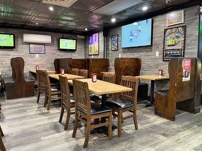 Booth seating and multiple TVs create the perfect atmosphere for enjoying ribs while catching the game with friends.