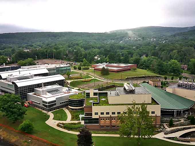 Modern campus architecture sprawls across the hillside, proving education has come a long way from one-room schoolhouses.