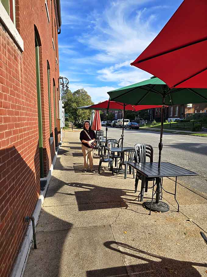 Sidewalk seating under bright umbrellas turns a simple sandwich into an event worth canceling other plans to attend.