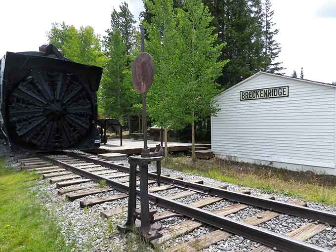Vintage rails and a replica depot building transport visitors to Breckenridge's bustling railroad era without requiring actual time travel technology.