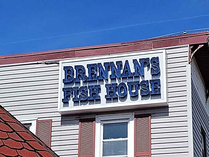 The bold blue lettering announces your destination like a lighthouse guiding hungry travelers to shore safely.