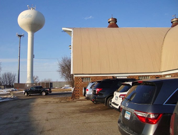 Even the parking lot view reveals this barn's impressive scale, with the Buffalo water tower standing guard in the distance.