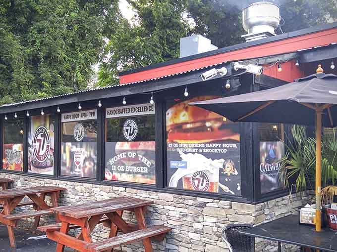 The exterior promises handcrafted excellence and home of the seven-ounce burger, which feels charmingly modest given what actually awaits inside.