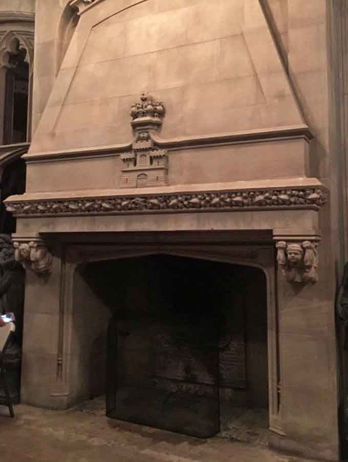 This ornate fireplace once warmed a room bigger than most New York apartments, naturally.