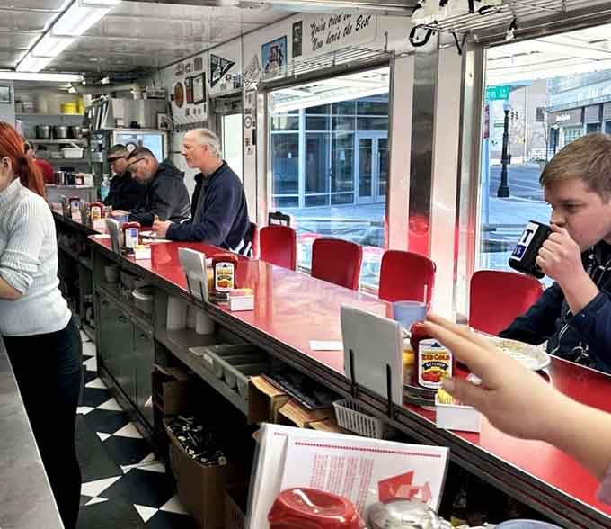 Counter seating creates instant community: strangers united by excellent taste in breakfast spots and life choices.