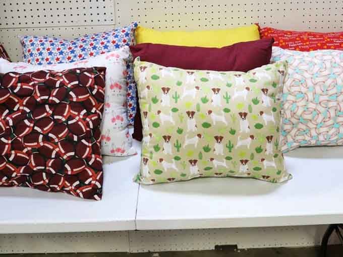 Decorative pillows in patterns ranging from subtle to "my couch is having an identity crisis," all waiting for your approval.