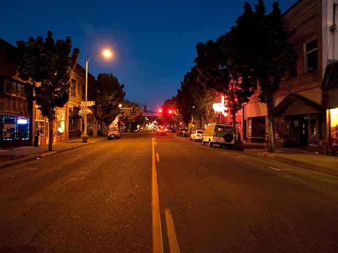 Main Street at night glows with a quiet charm that says you can actually walk around here after dark, imagine that.