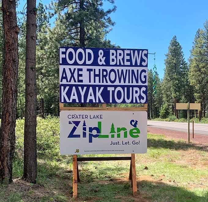 One sign advertising ziplines, axes, kayaks, and food: basically everything you need for the perfect Oregon adventure day.