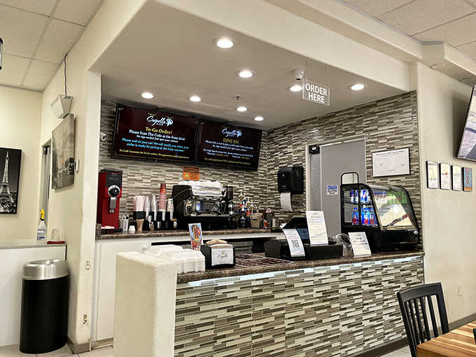 The ordering counter with its tile backsplash and espresso machine, where all the crepe magic begins its journey.