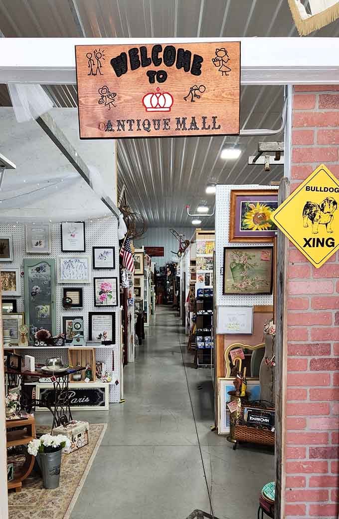 The welcoming pathway at Crown Antique Mall Inc. stretches endlessly forward, each turn revealing another booth worth exploring thoroughly.