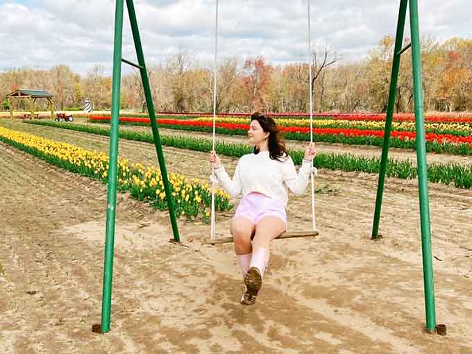 A swing positioned perfectly among the tulips, because sometimes you need to feel like a kid again.