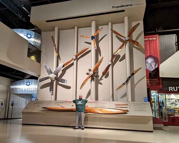 Propeller display showcases evolution from wood to metal, each blade representing decades of engineering innovation and dreams.