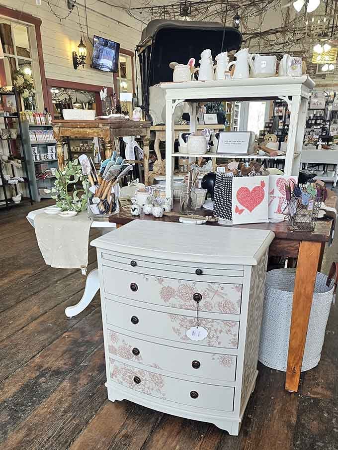 Shabby chic furniture displayed like art, because one person's old dresser is another person's perfect dining room centerpiece waiting to happen.