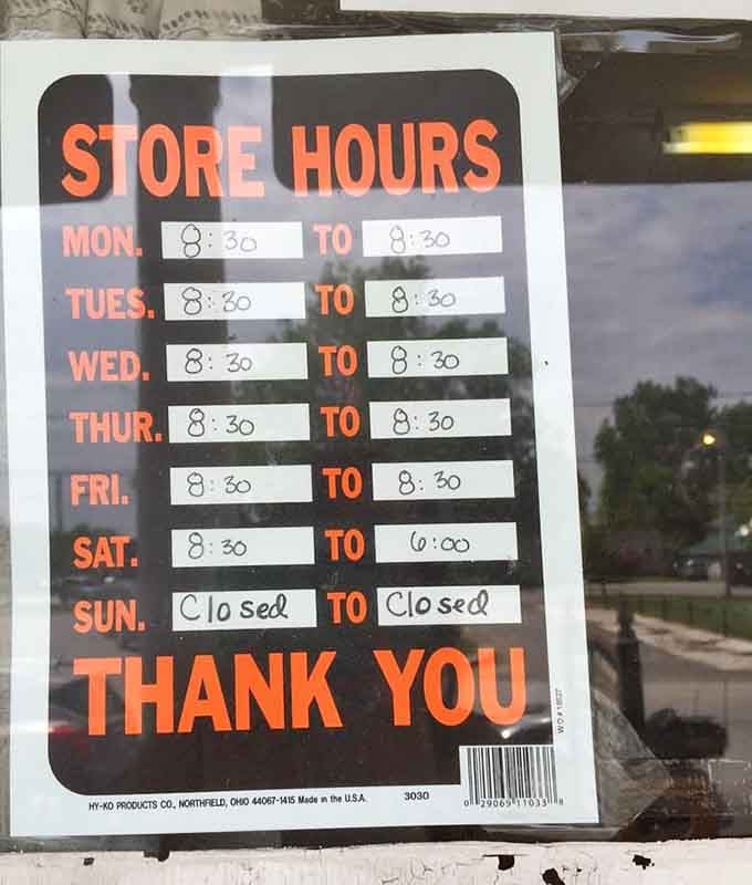 Handwritten hours remind visitors this store values Sundays off, respecting traditions modern retailers have forgotten.