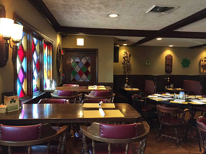 Another angle of the dining room shows off those distinctive stained glass windows and cozy booth seating.