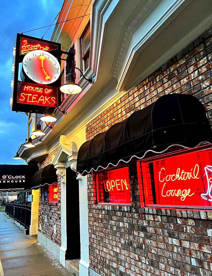 That glowing neon beckons like a lighthouse guiding hungry souls to their delicious destiny.