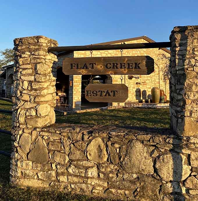 The Flat Creek Estate sign marking your arrival at one of Texas's best-kept wine country secrets.
