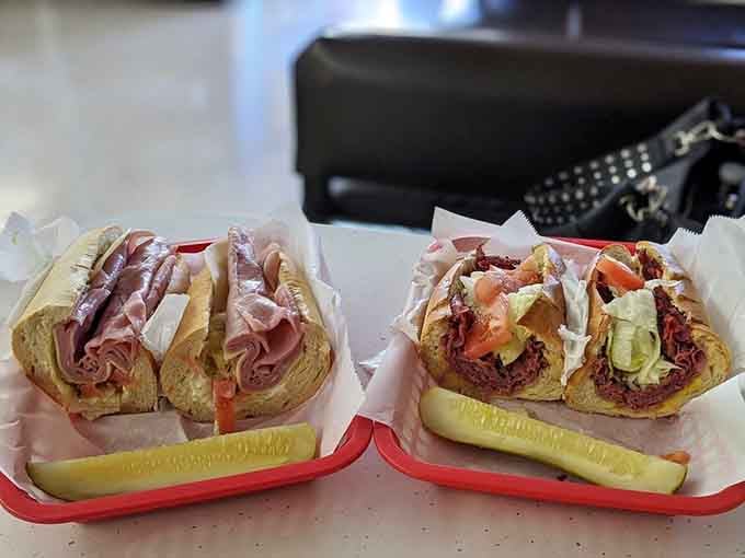 Two sandwiches, one pickle, infinite possibilities for happiness, all wrapped and ready to devour immediately.
