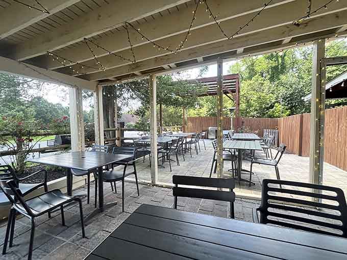 Covered patio seating with string lights overhead creates the perfect spot to demolish a chicken box with friends and family.