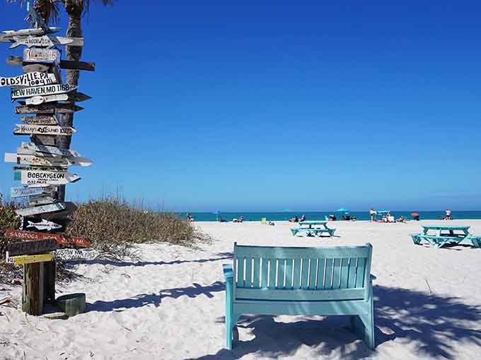A turquoise bench facing paradise, the best seat in Florida that doesn't require a reservation.