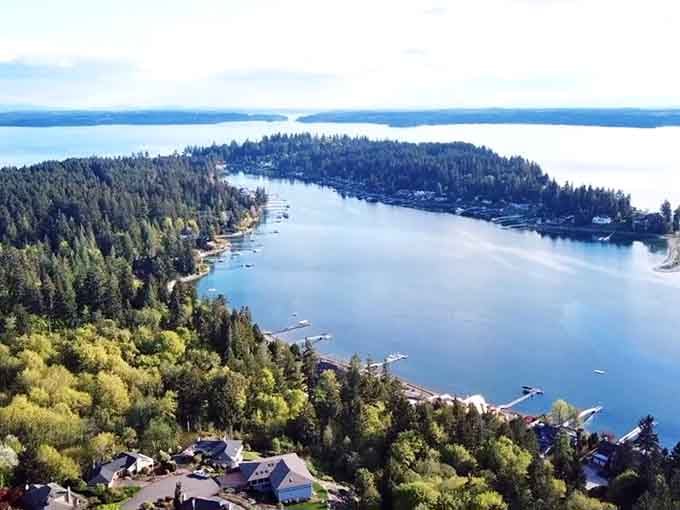 Aerial views reveal the harbor's horseshoe shape, cradling boats and dreams in equal measure from above.