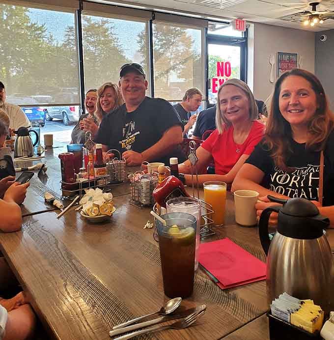 Happy diners gathered around a table: the universal sign that you've discovered a restaurant worth returning to repeatedly.