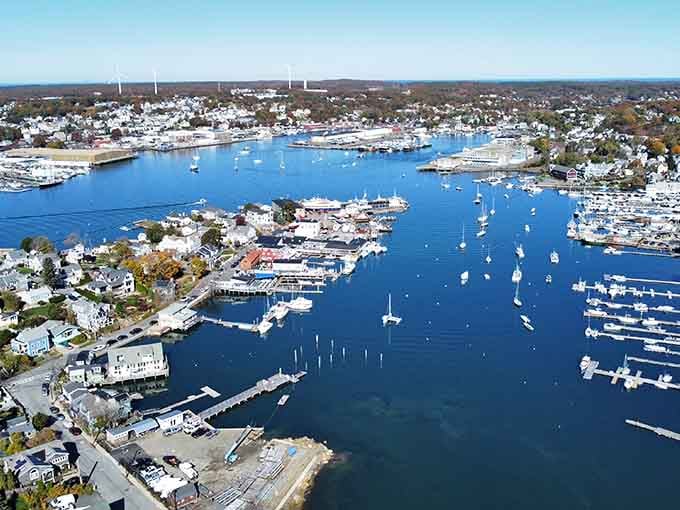 Gloucester Harbor from above reveals a working waterfront where boats outnumber your unread emails by a comfortable margin.