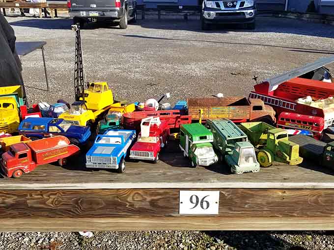 Vintage toy trucks lined up like a miniature parade, reminding us when toys were built to survive actual childhood play.
