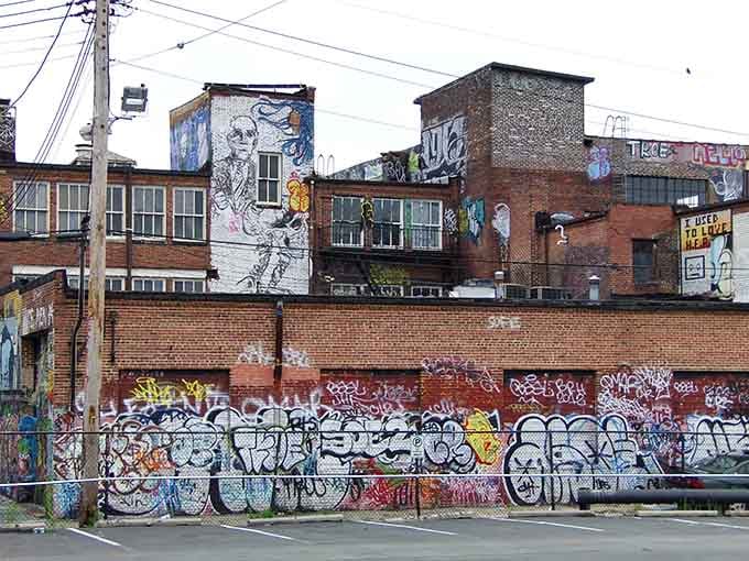 Industrial architecture meets urban artistry, where old brick buildings provide the perfect backdrop for contemporary creative expression and vision.