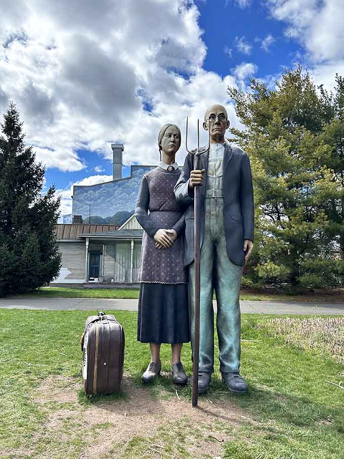 This stoic couple with their suitcase looks ready for adventure, or at least a very artistic road trip.