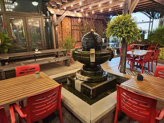 Outdoor patio seating with a fountain centerpiece, perfect for enjoying Austrian cuisine under Missouri skies on pleasant evenings.