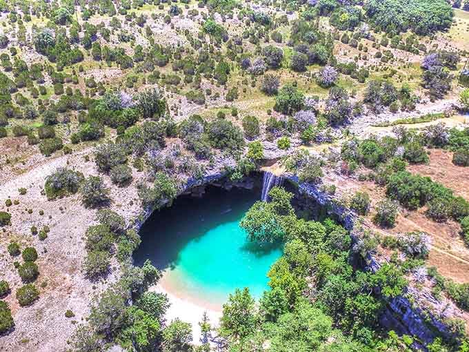From above, the pool resembles a turquoise jewel set in Hill Country landscape, hidden until you know where to look.